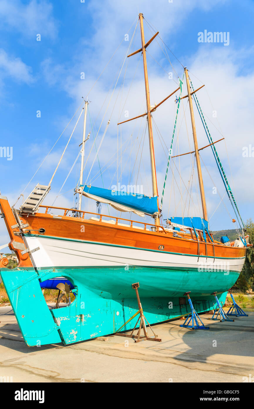 Traditional wooden sail boat in shipyard of small Greek marina, Samos ...