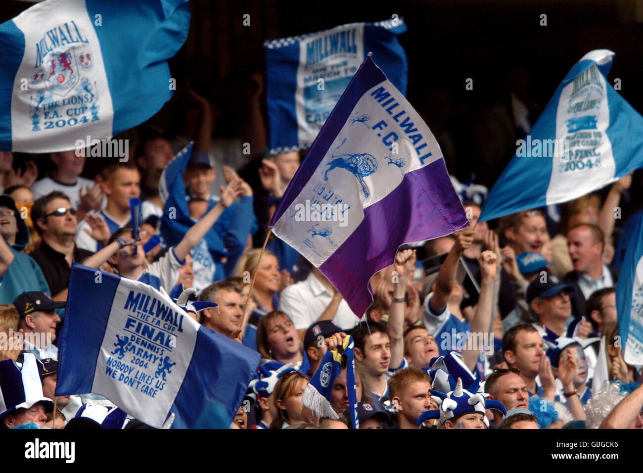 Millwall fans wave their flags in support of their team Stock Photo - Alamy