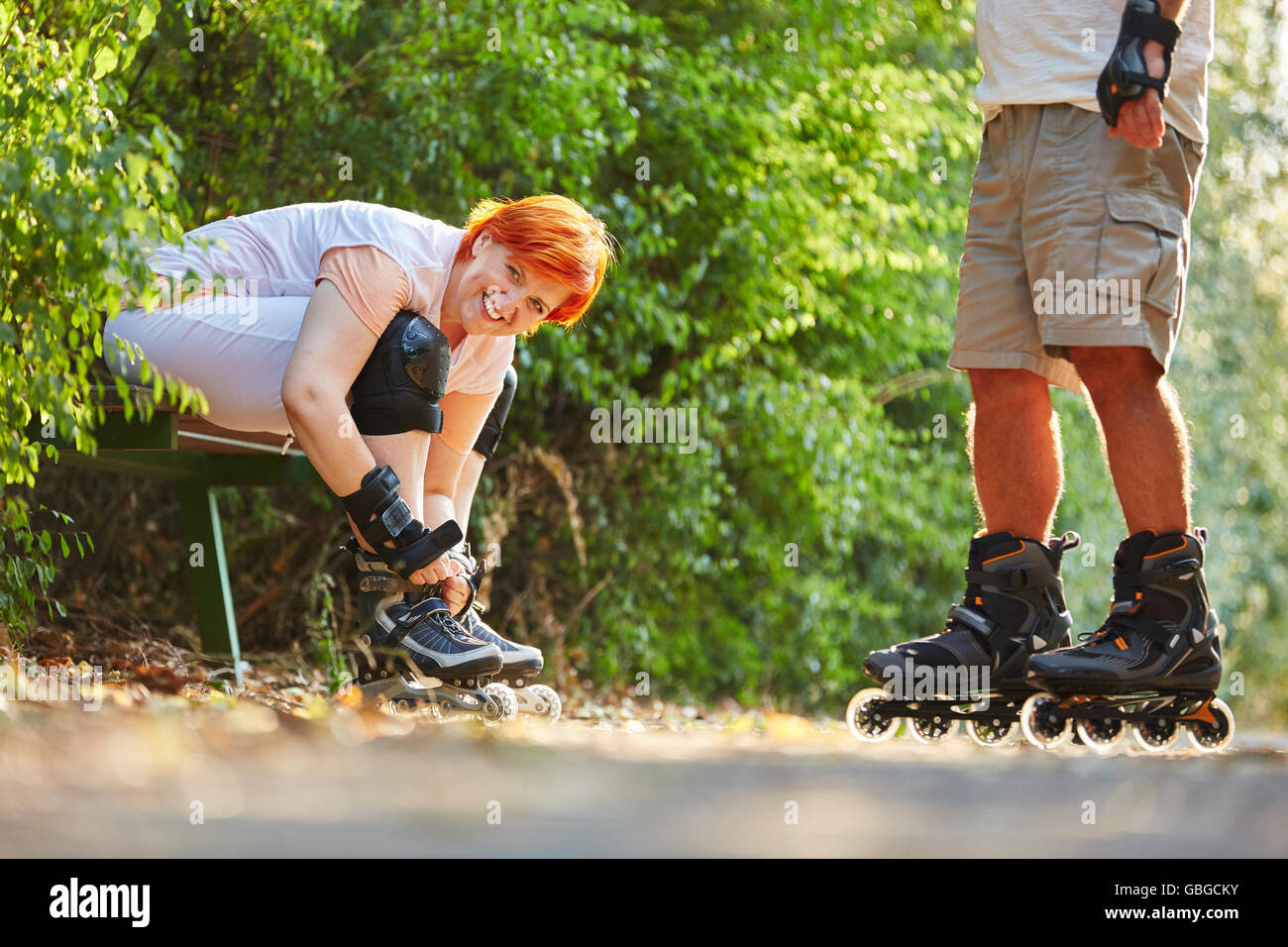 Active senior couple after rollerblading in the summer Stock Photo - Alamy
