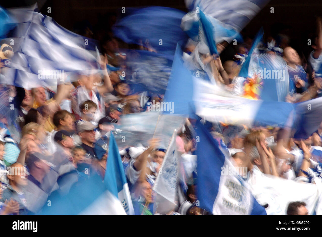 Millwall fans wave their flags in support of their team Stock Photo - Alamy