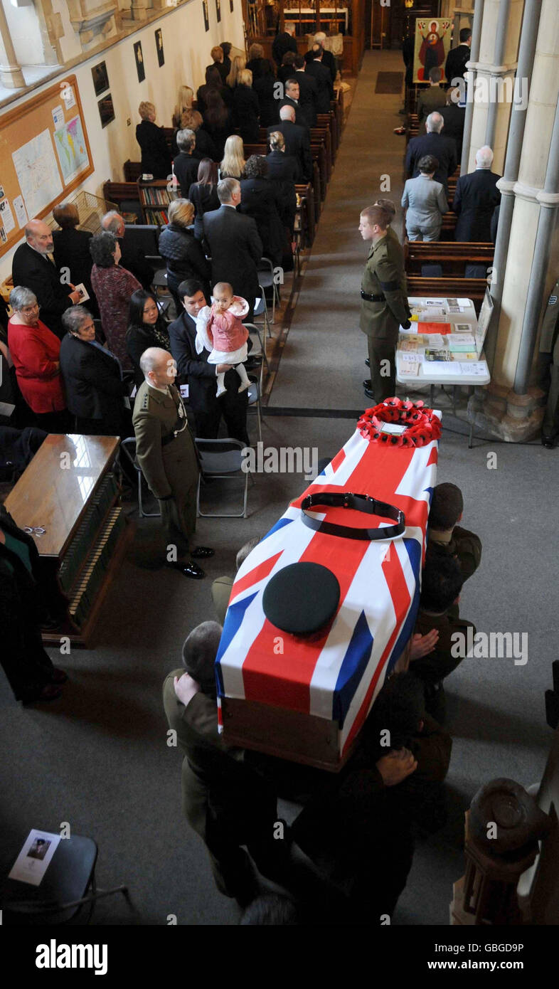 The coffin of Rifleman Jamie Gunn, 22, is carried into St Mary's Church ...