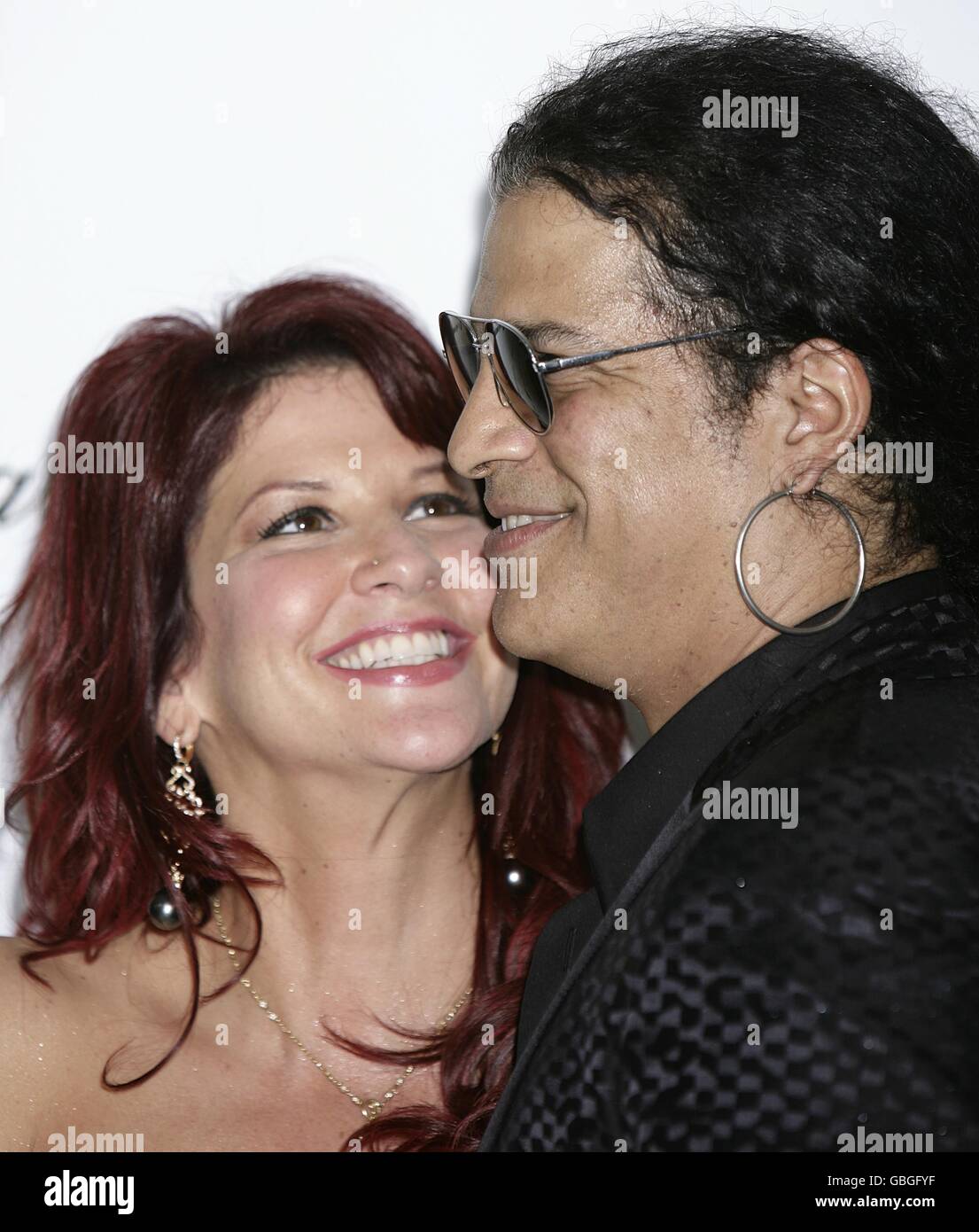 Slash and wife Perla arriving for the 17th annual Elton John AIDS ...
