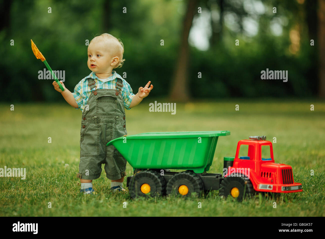 little constructor with shovel Stock Photo - Alamy