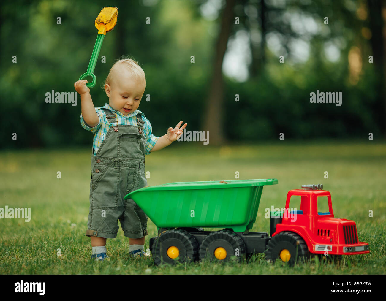 little constructor with shovel Stock Photo - Alamy