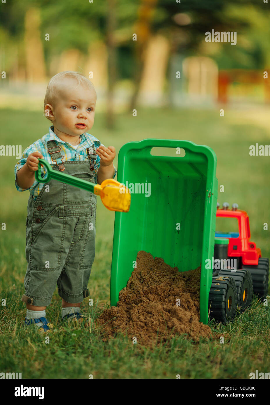 little constructor with shovel Stock Photo - Alamy