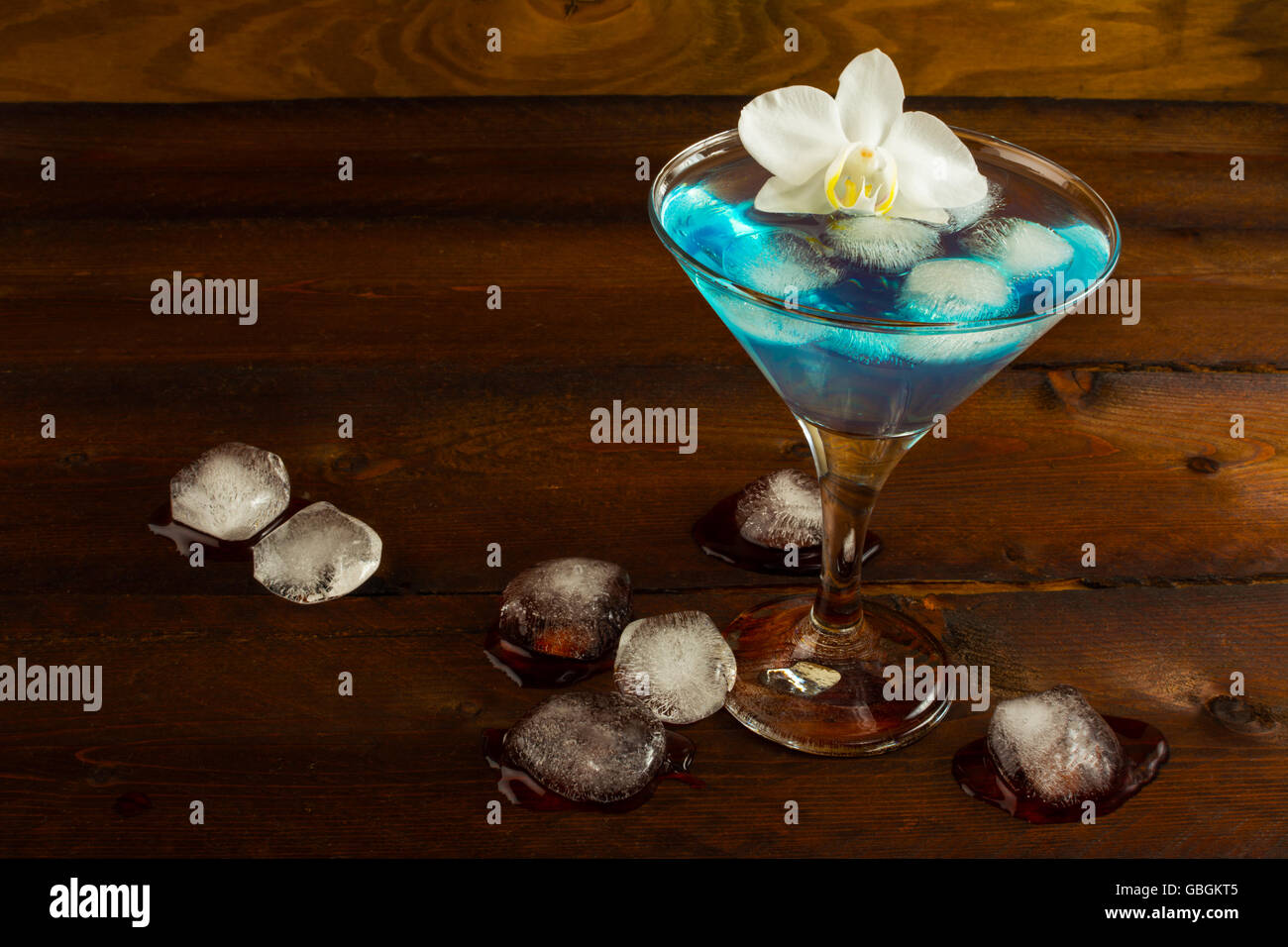 Blue cocktail served with orchid. Blue cocktail. Blue Martini. Blue ...