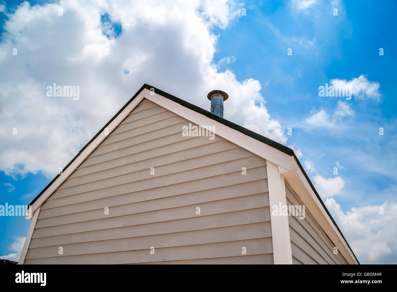 Fragment of the small wooden house, sky background Stock Photo - Alamy
