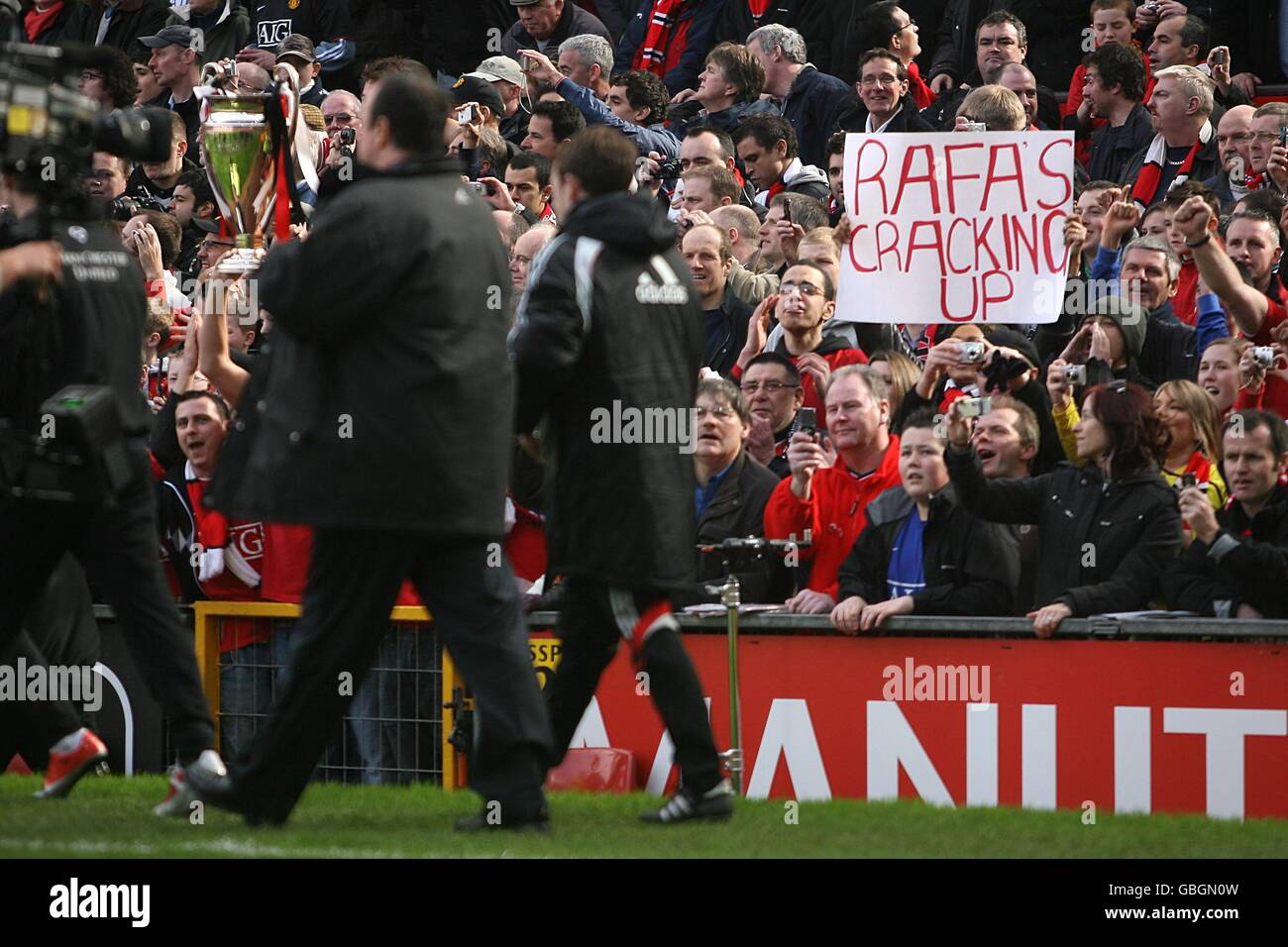 Manchester United fans show their support in the stands, as Liverpool ...