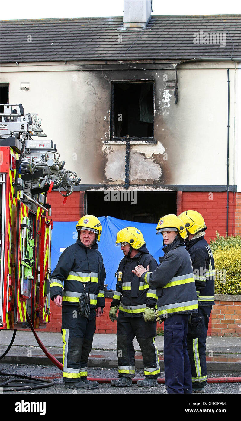 Firefighters outside the scene of a house fire on the Moneymore estate ...