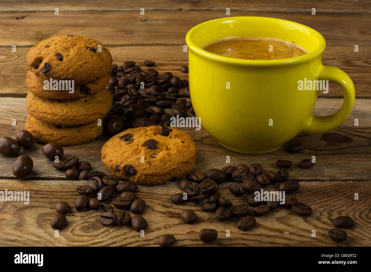 Yellow mug of strong coffee and cookies. Cup of coffee. Strong coffee ...