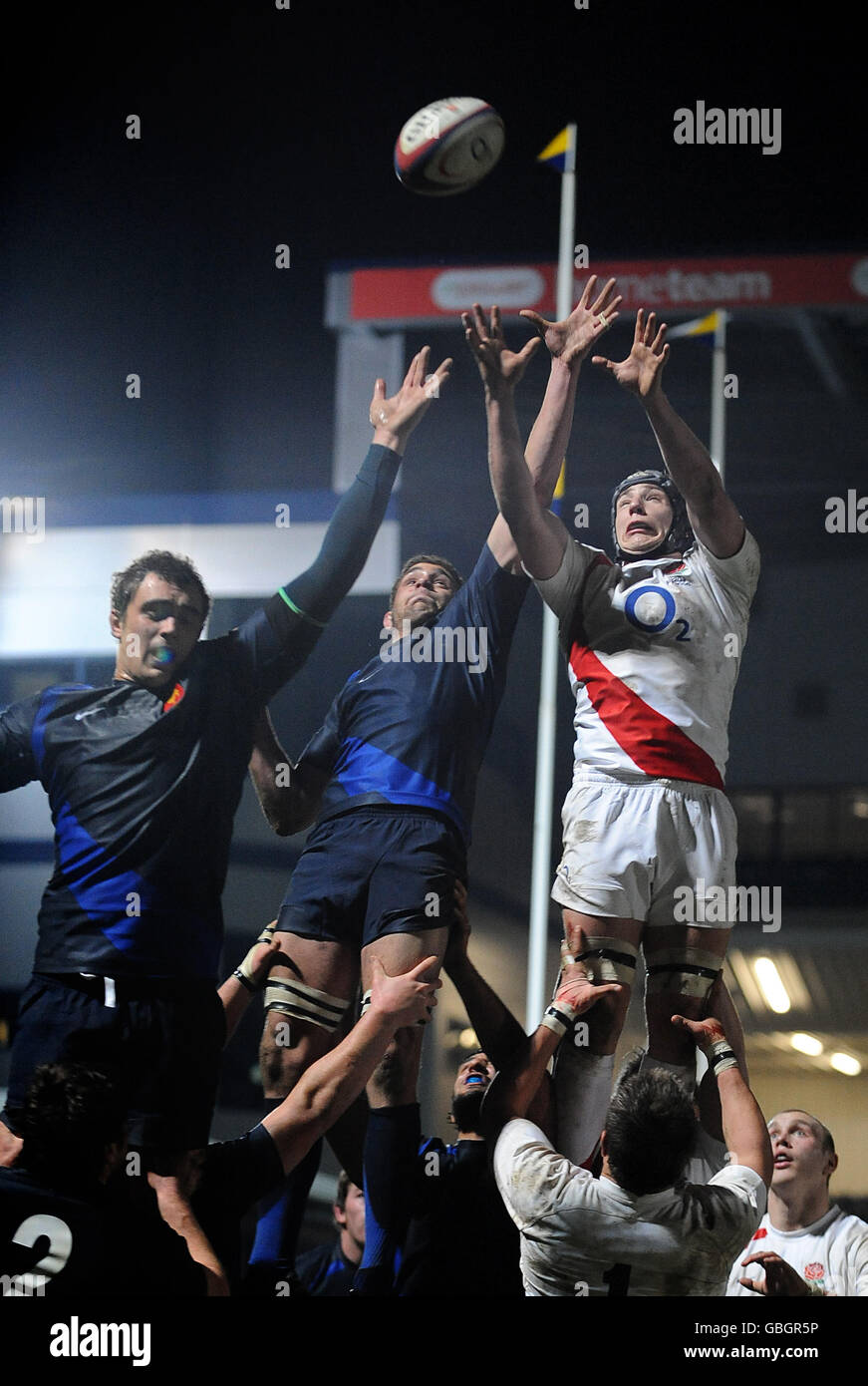 England's Jacob Rowan (right) rises high in a line out against the ...