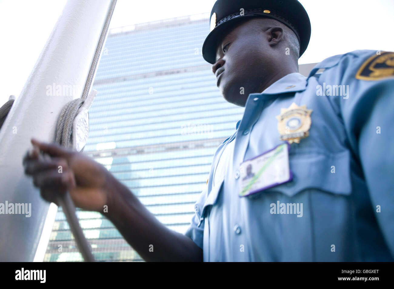 8 September 2005 - New York City, NY - A security guard raises a member ...