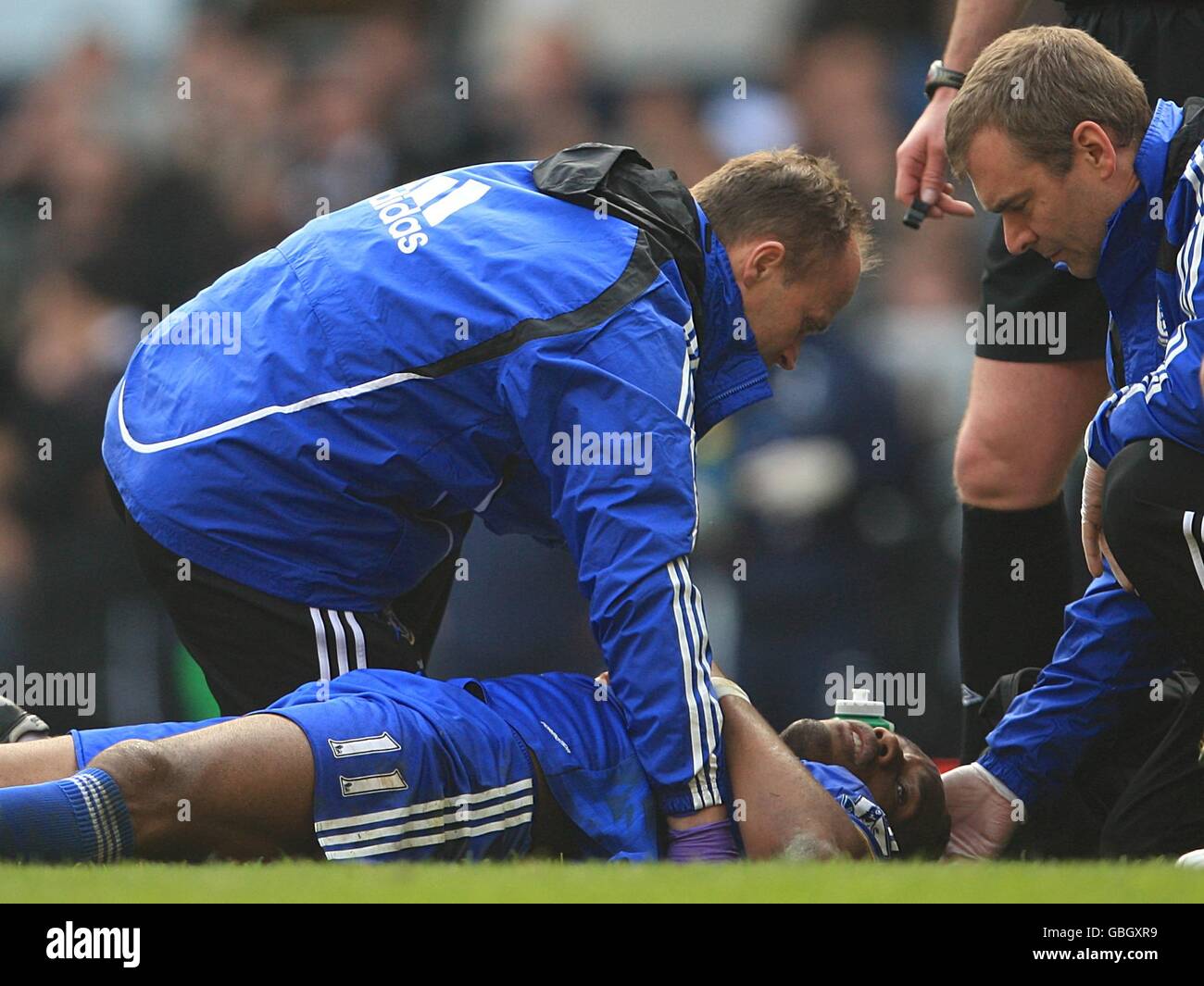 Chelseas didier is treated on the pitch following an injury hi-res ...