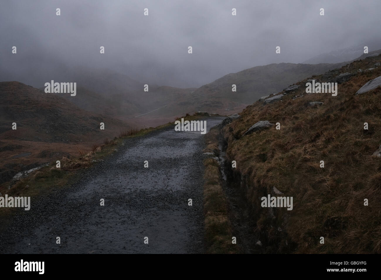 Snowdon miners path in wet weather Stock Photo - Alamy