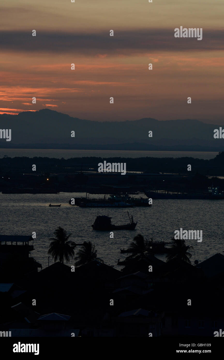 the sunset at the Harbour at the coast of the Andaman sea of Myeik in ...