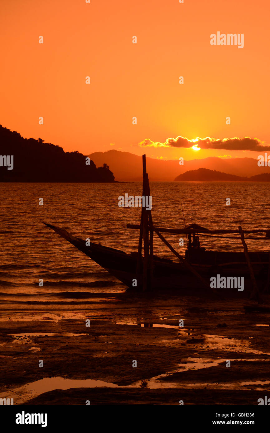 the sunset at the Harbour at the coast of the Andaman sea of Myeik in ...