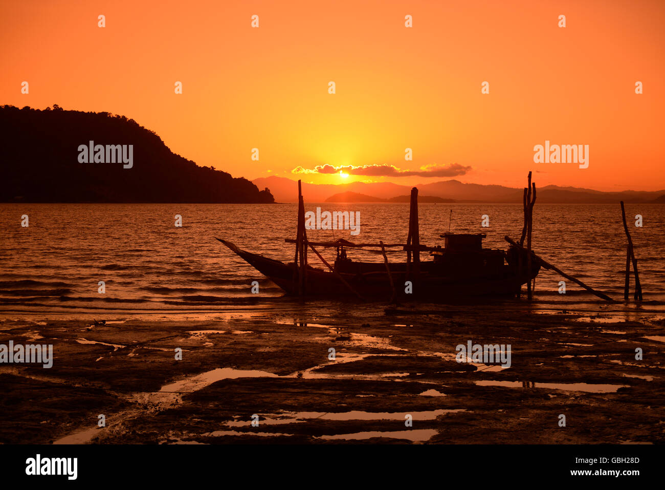 the sunset at the Harbour at the coast of the Andaman sea of Myeik in ...