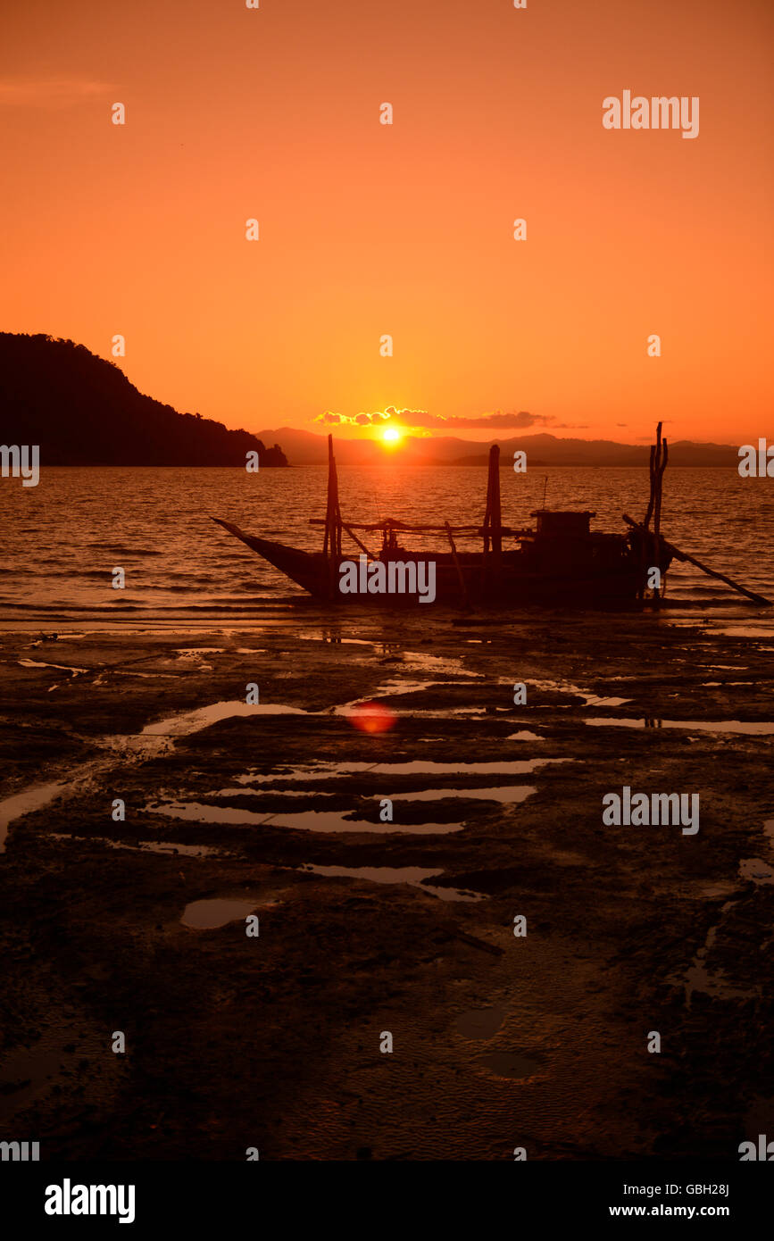 the sunset at the Harbour at the coast of the Andaman sea of Myeik in ...