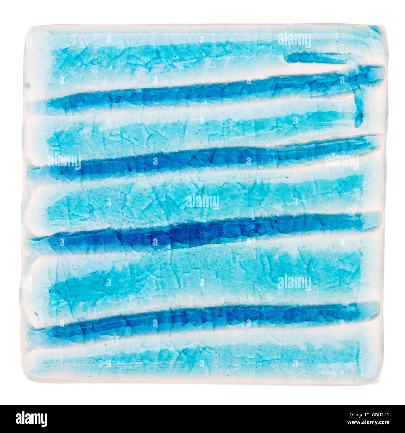 Blue lined handmade glazed ceramic tile isolated on white background ...