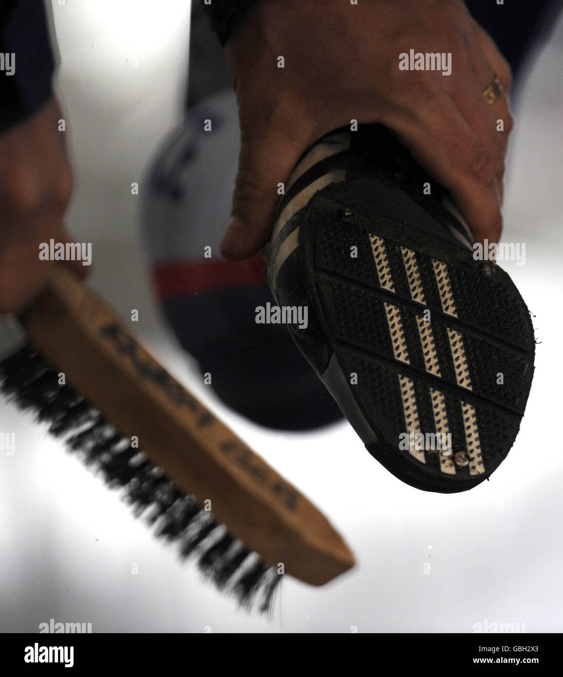 A competitors shoe is cleaned at the start hi-res stock photography and ...