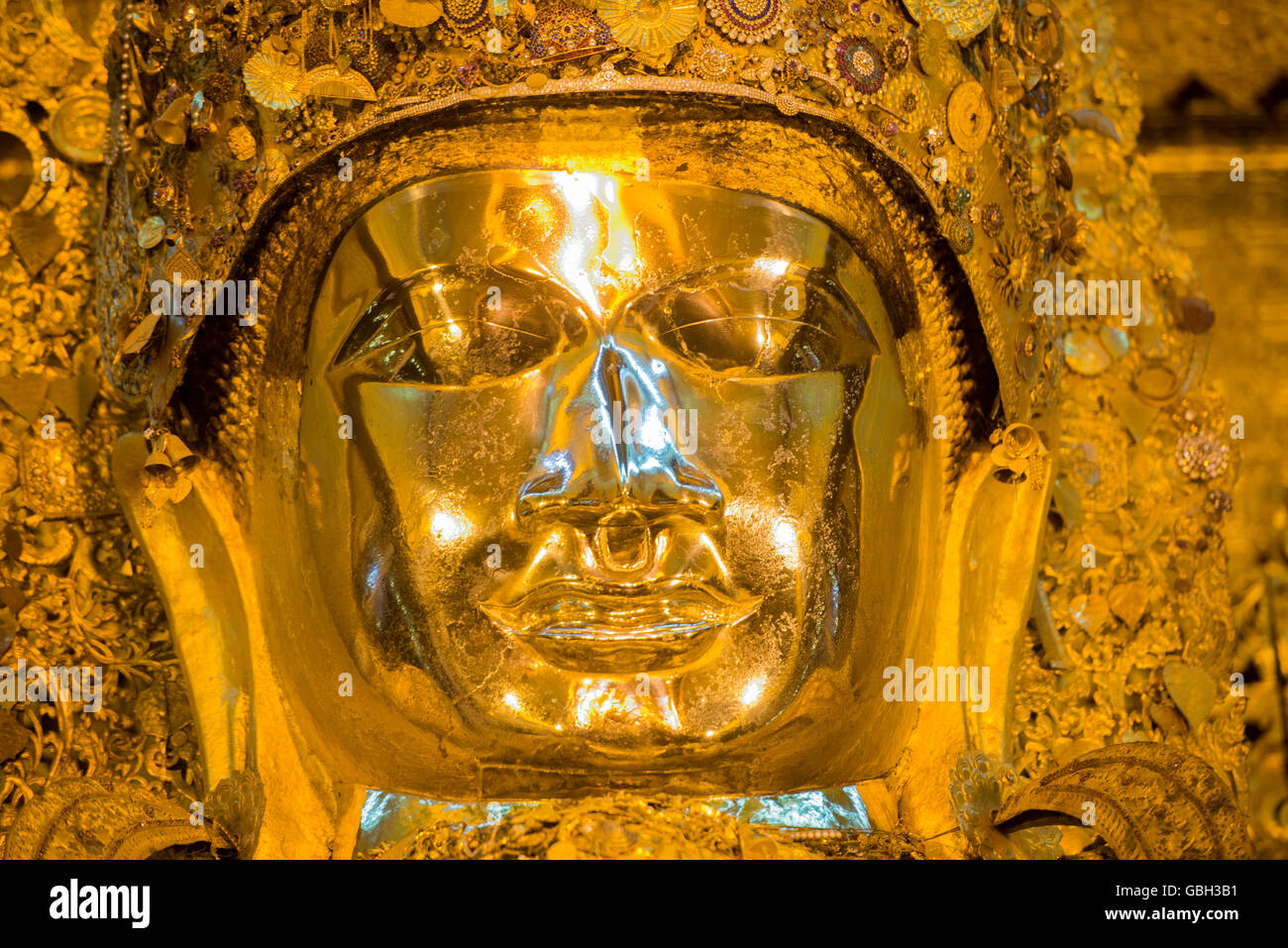 The Mahamuni Buddha at the Mahamuni temple in the City of Mandalay in ...