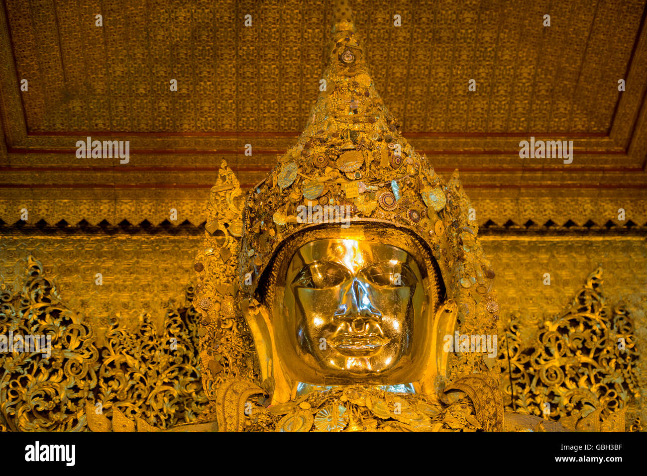 The Mahamuni Buddha at the Mahamuni temple in the City of Mandalay in ...