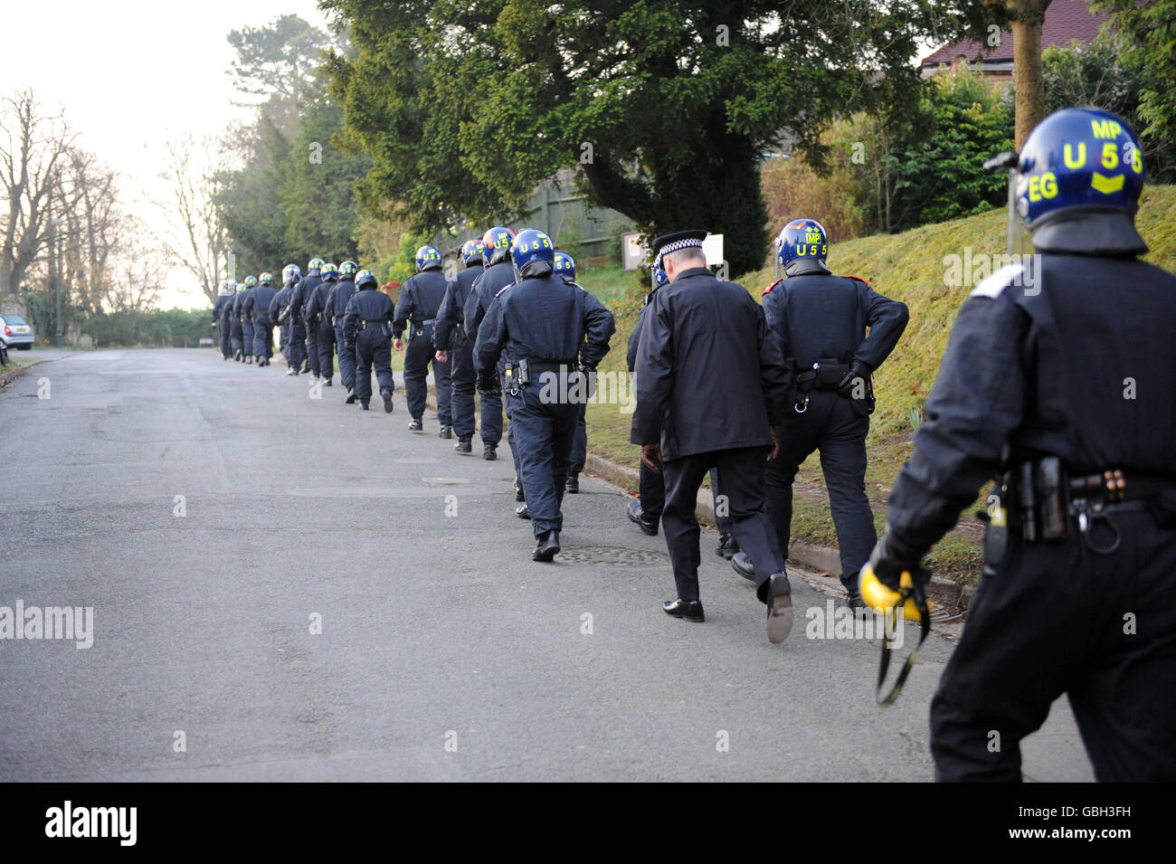 Back view police raid hi-res stock photography and images - Alamy