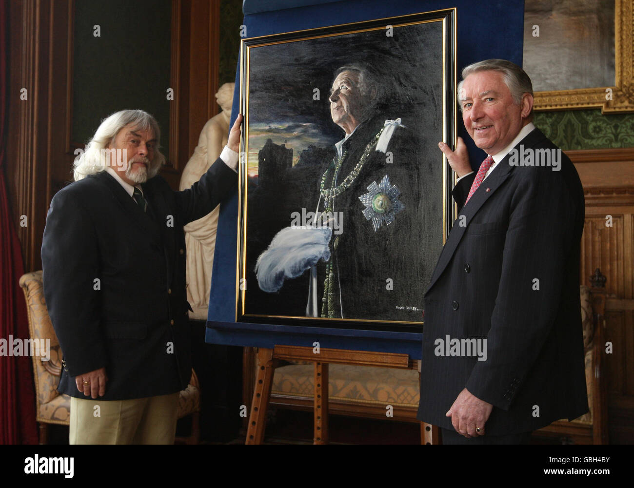Lord David Steel (right) is presented with a portrait painted by artist ...
