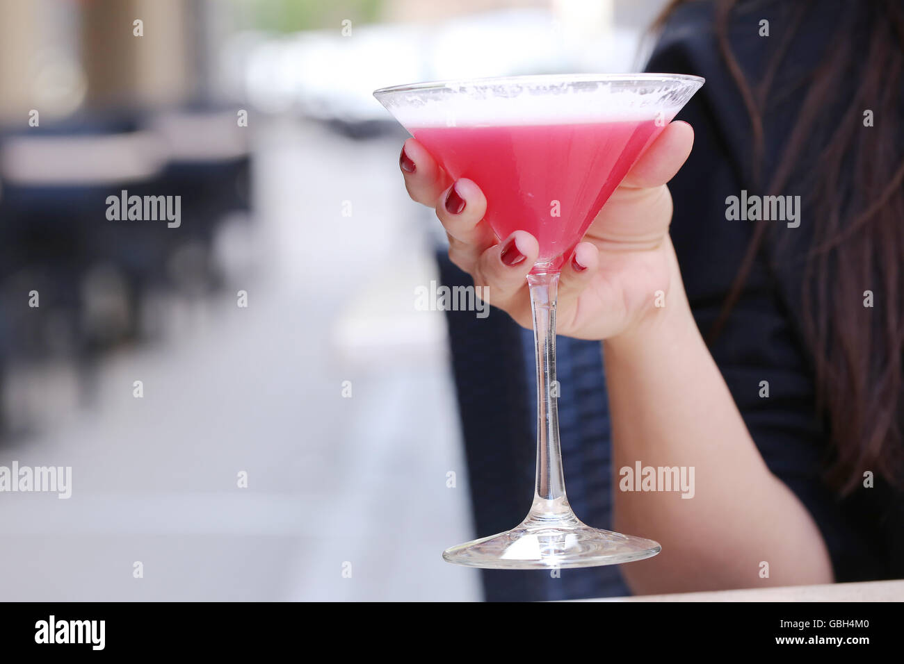 Woman with a drink Stock Photo - Alamy