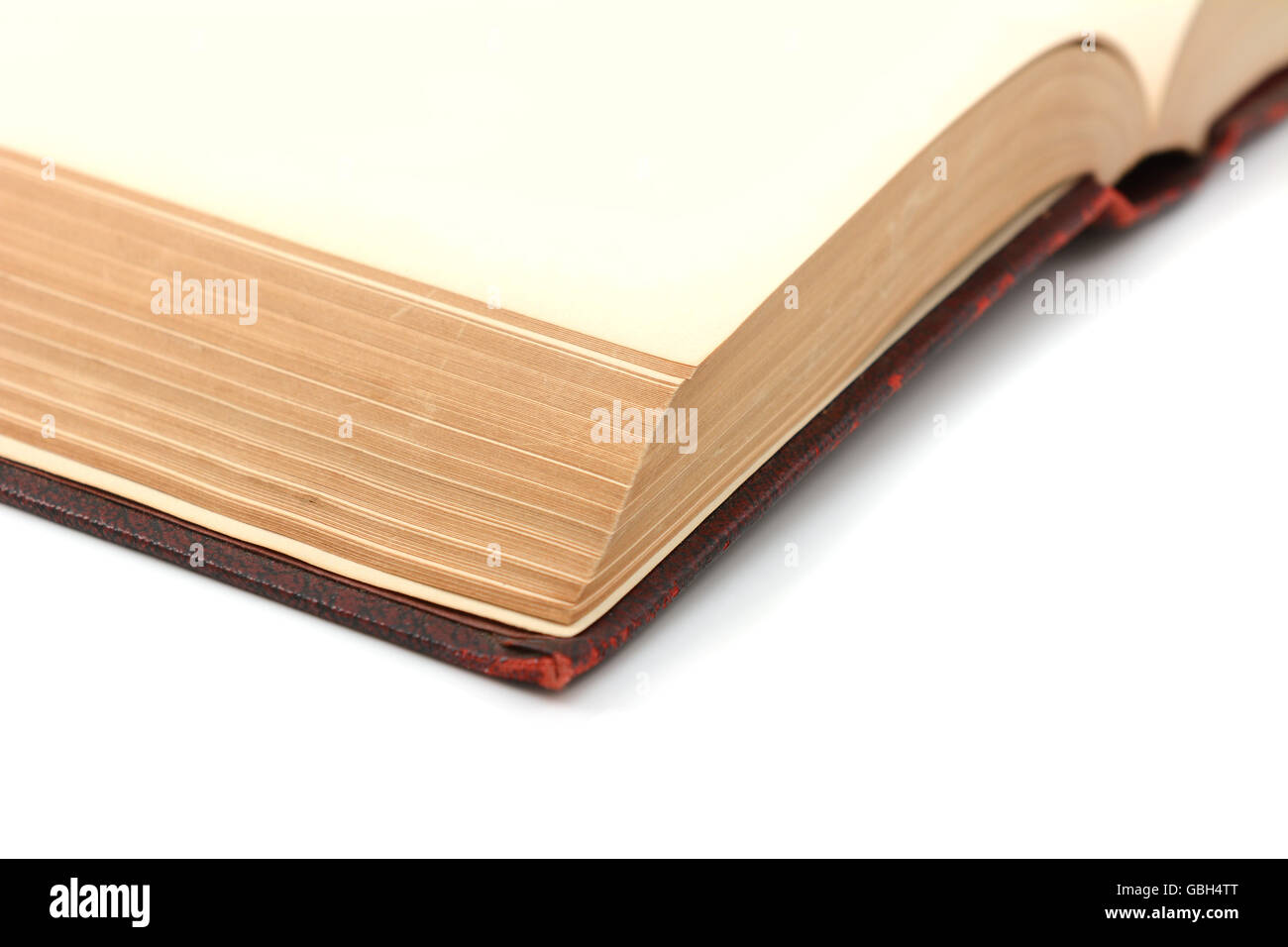 Close-up of blank pages in a bound, thick hardcover book on a white ...