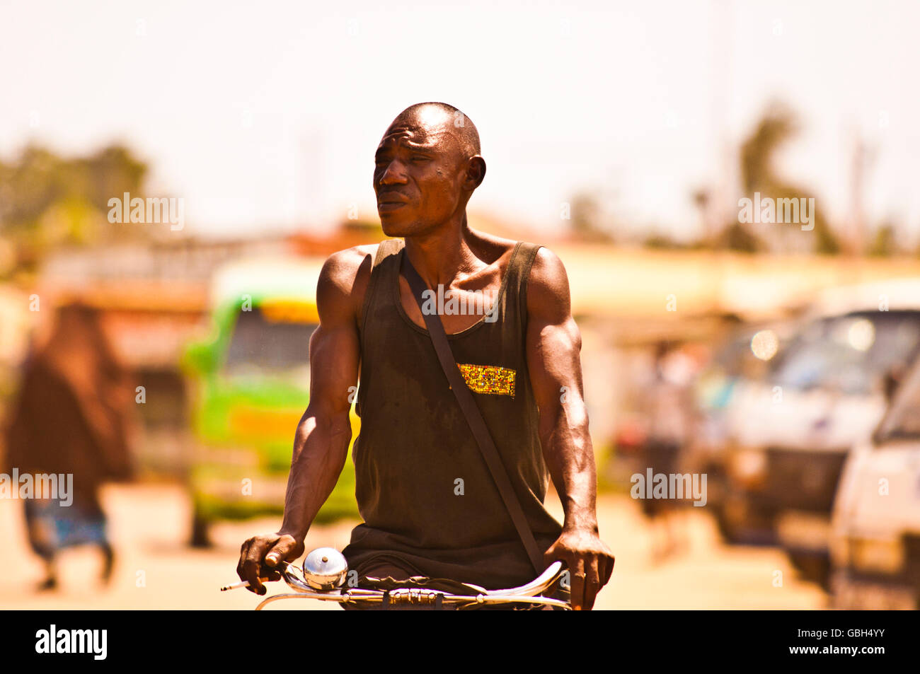 MOMBASSA, KENYA. DECEMBER 18, 2011: A lean Kenyan man rides his push ...