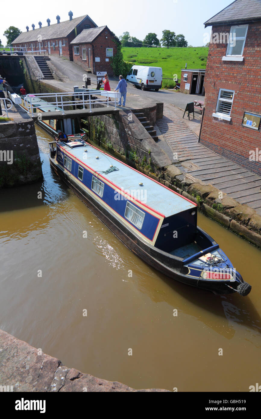 Narrowboat exiting Bunbury staircase locks, Cheshire, England Stock ...