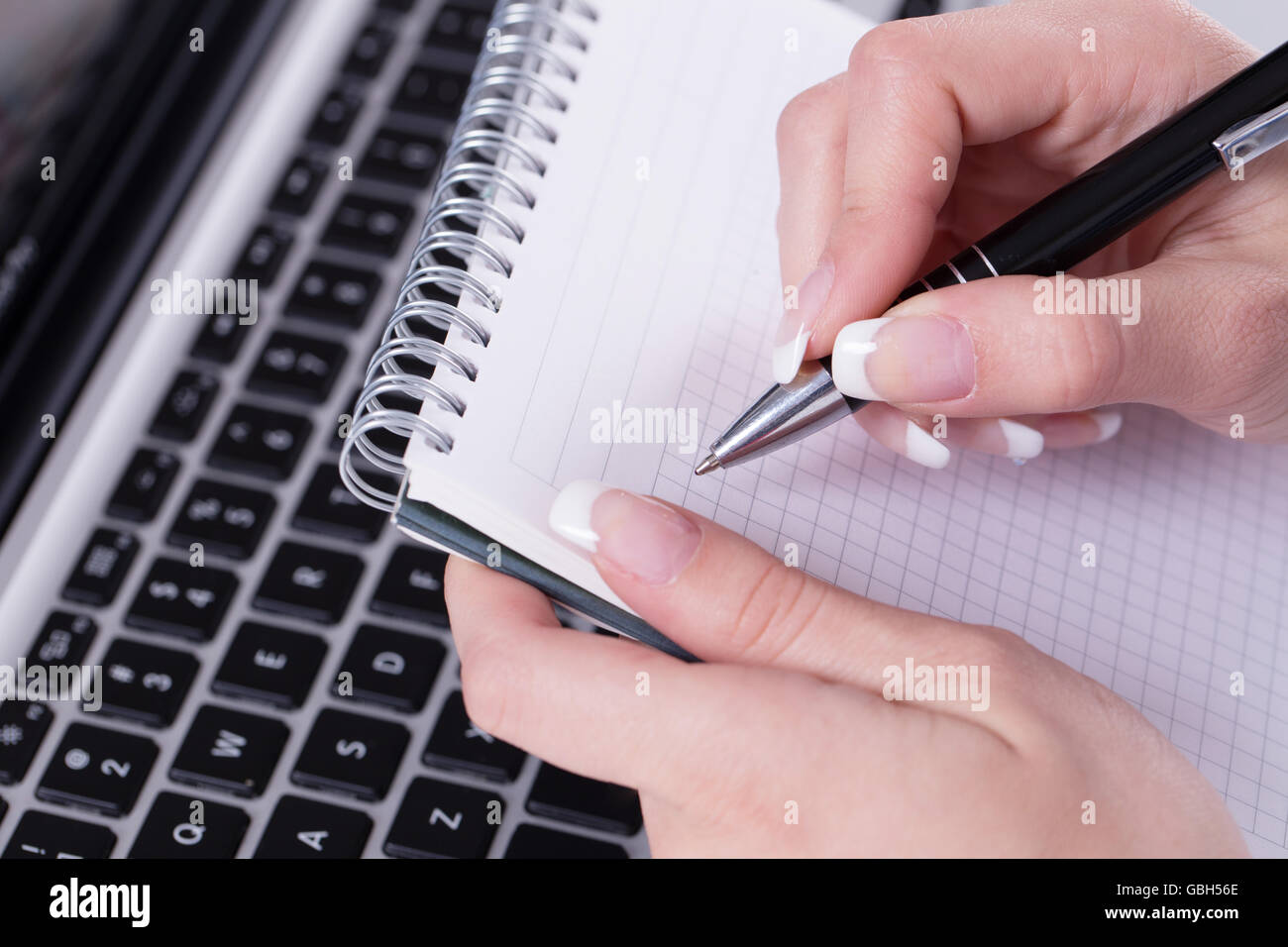 Woman with a notepad Stock Photo - Alamy