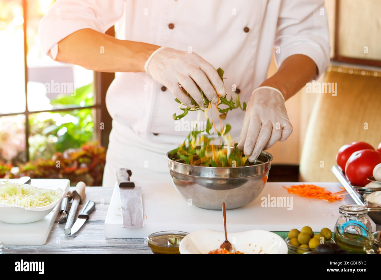 Male chef making salad hi-res stock photography and images - Alamy