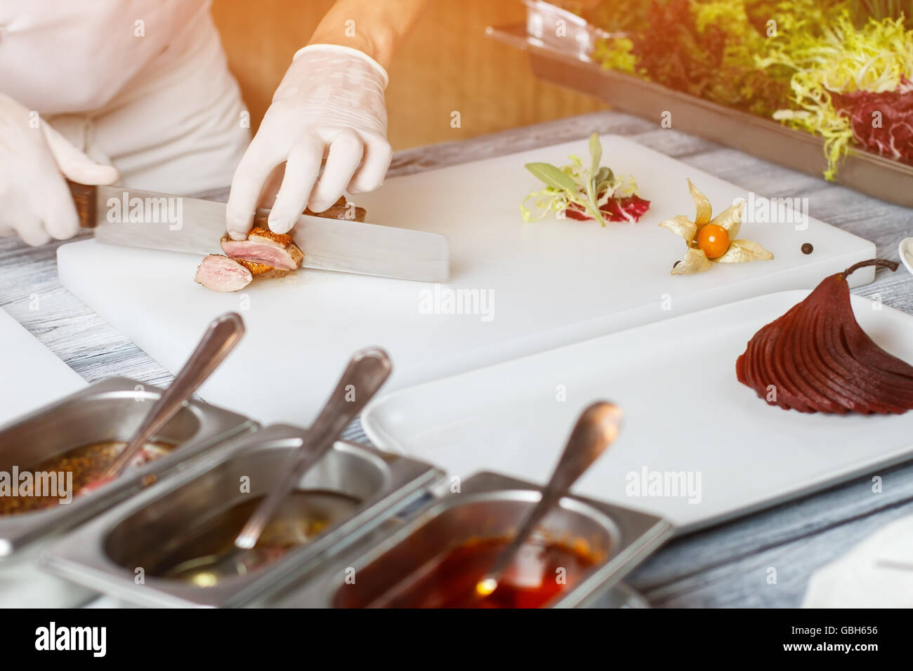 Knife cutting cooked meat Stock Photo - Alamy
