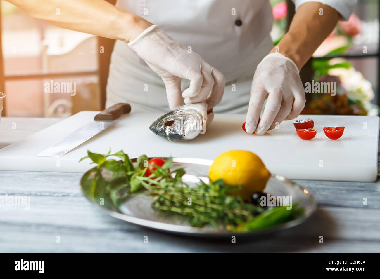 Man's hands touching raw fish Stock Photo - Alamy
