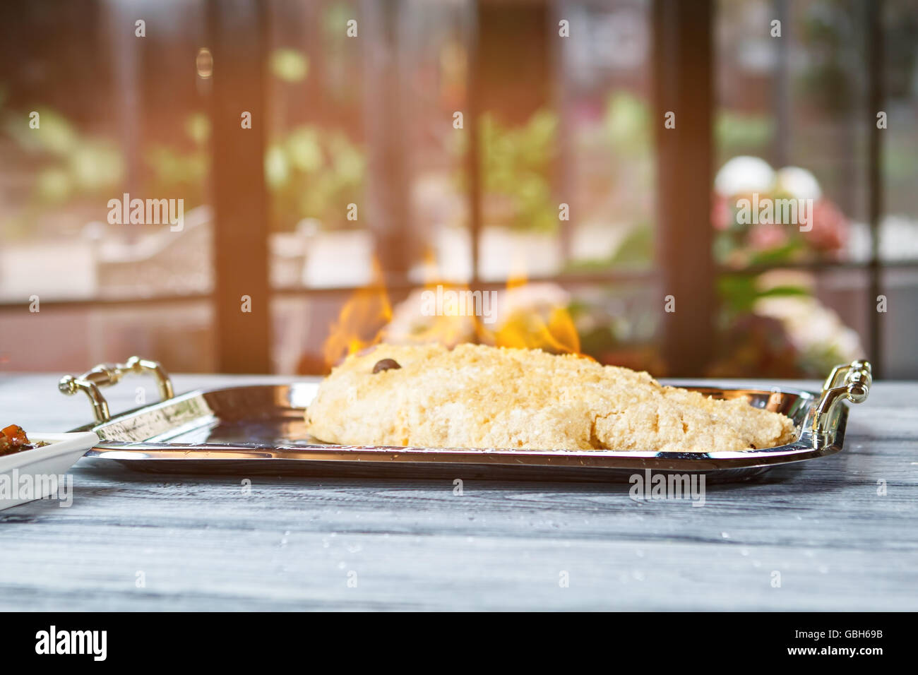 Burning fish on tray Stock Photo - Alamy
