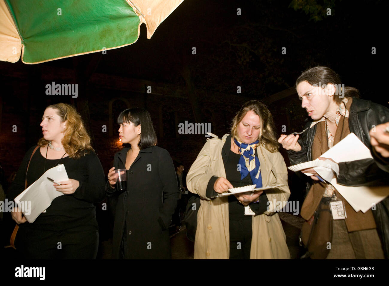 Judges taste food prepared by the four finalists of the 2006 Vendy ...