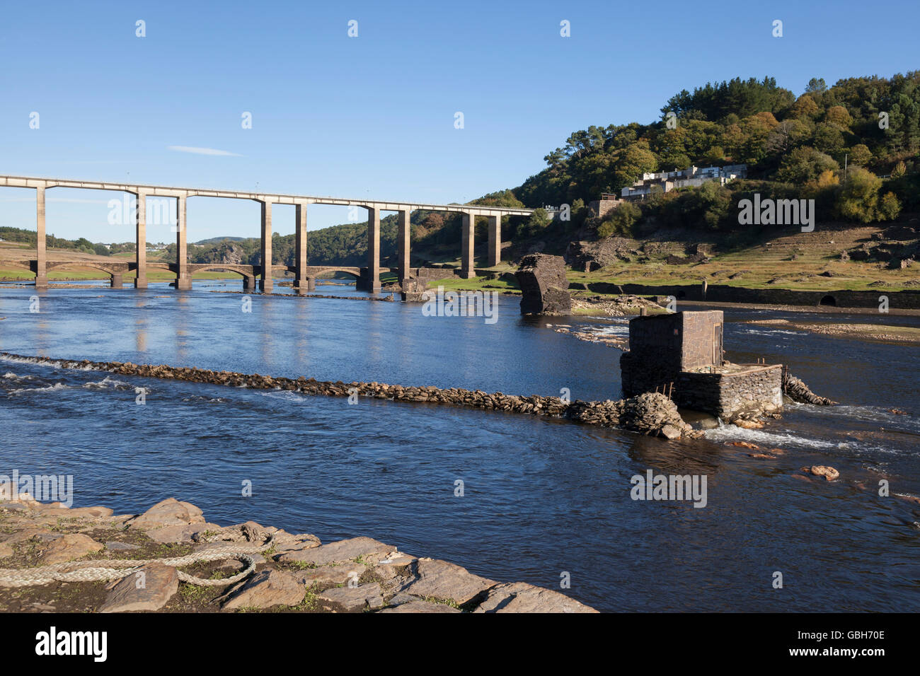 Portomarín, Spain: Remains of the old Roman bridge on the Minho River ...