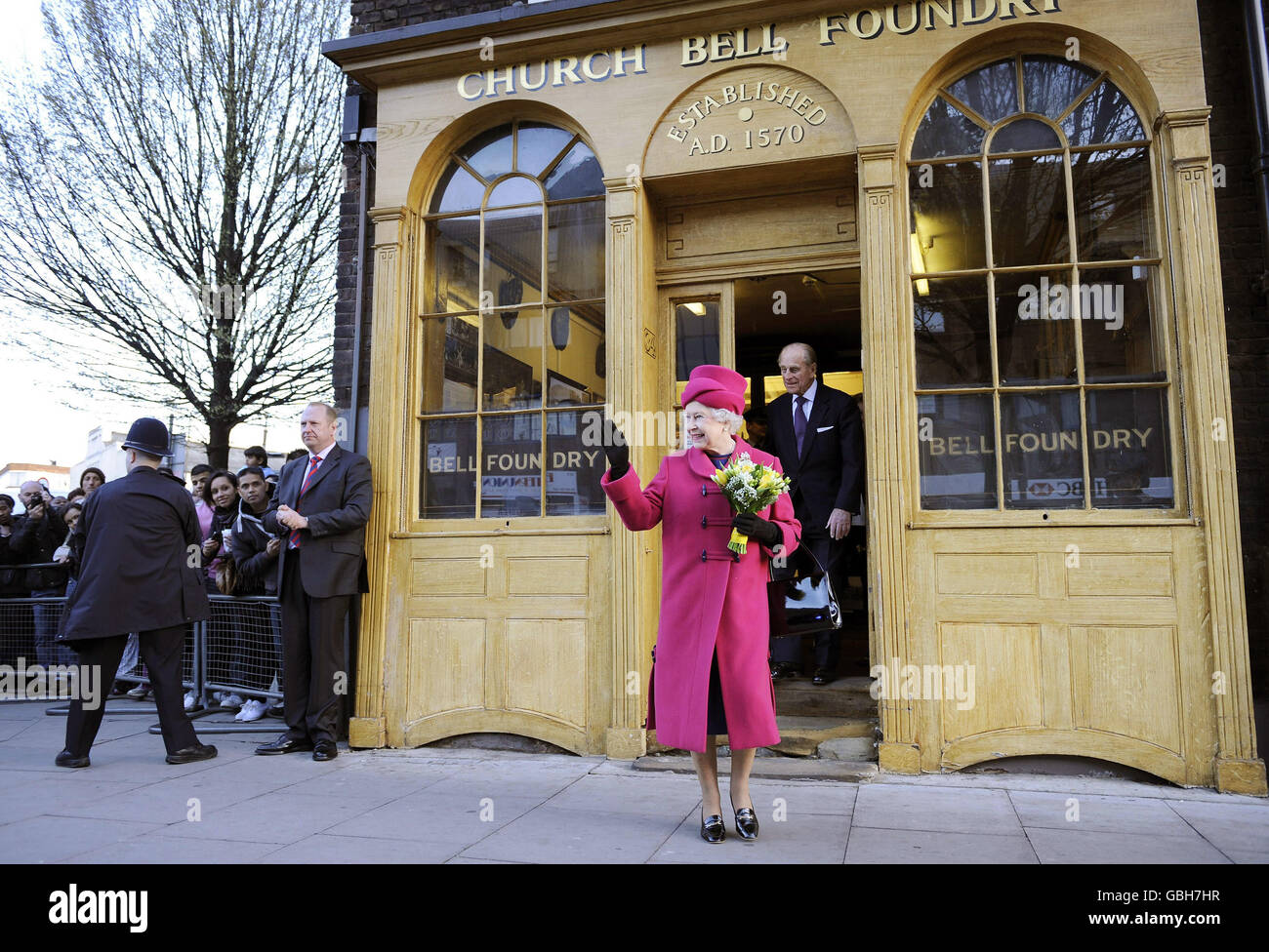 Queen Elizabeth II waves to the public as she leaves the Whitechapel ...
