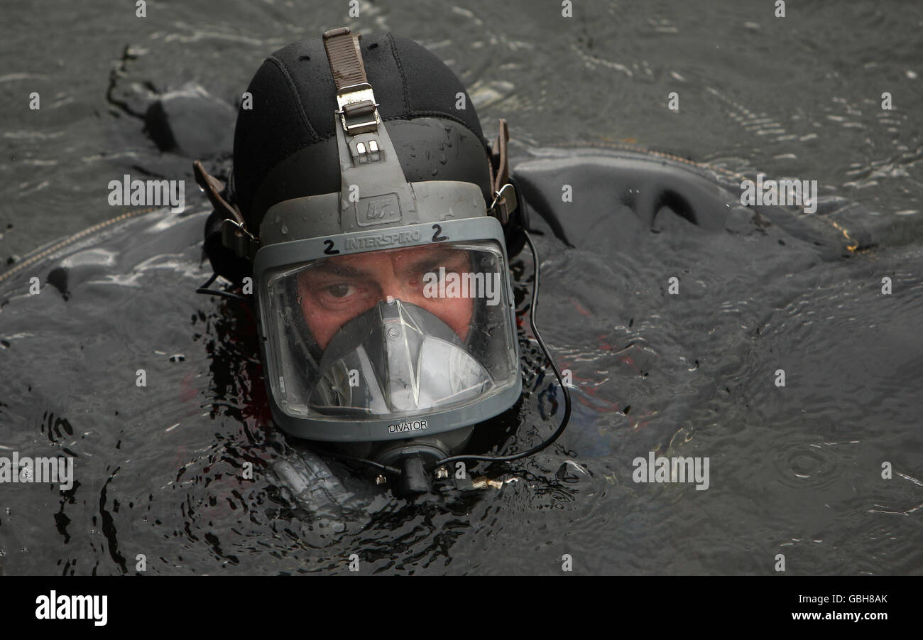 A Metropolitan Police diving team carry out a security search of the ...