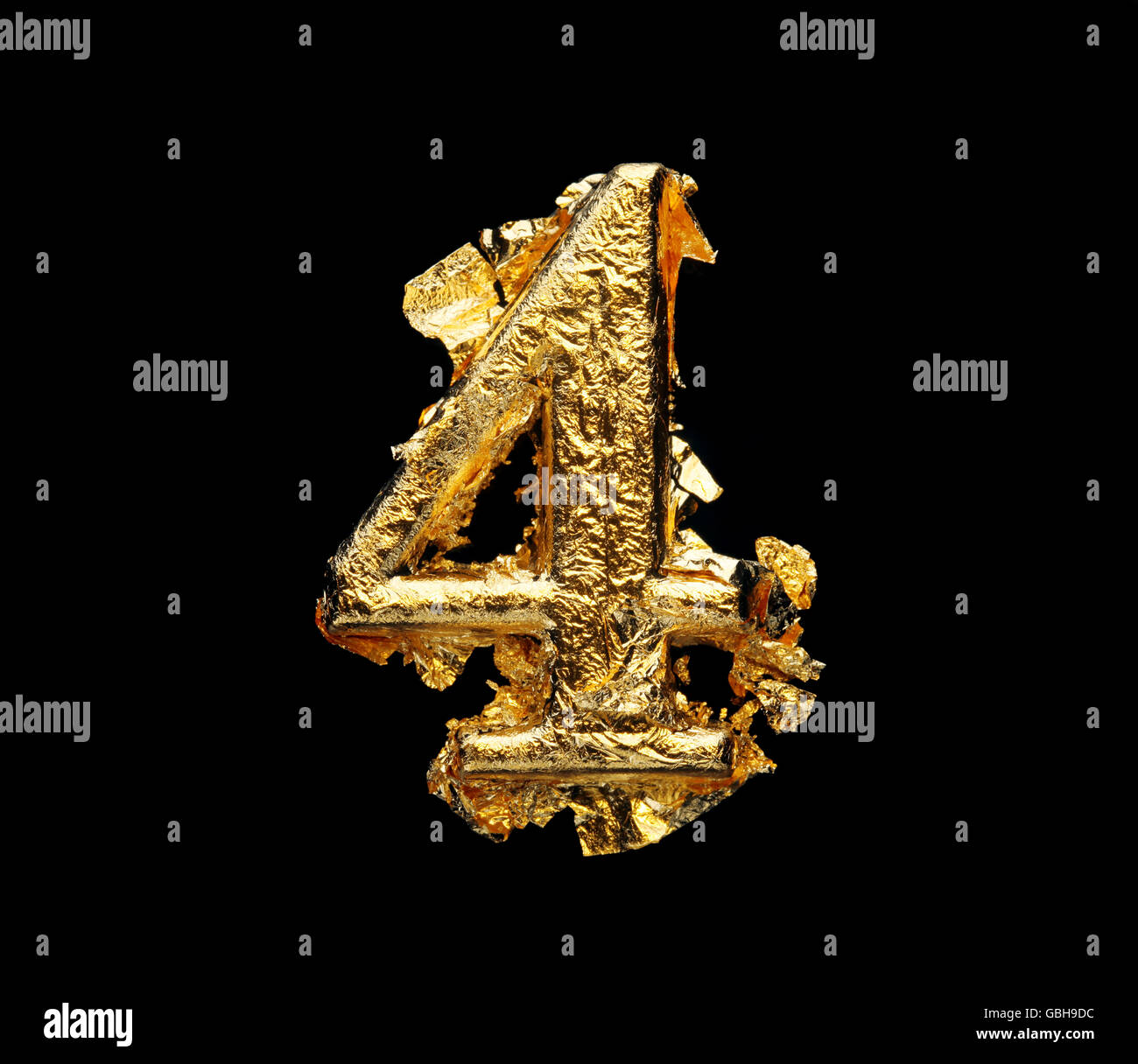 Alphabet and numbers in rough gold leaf isolated on black Stock Photo ...