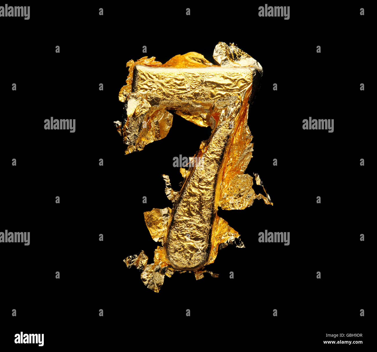 Alphabet and numbers in rough gold leaf isolated on black Stock Photo ...