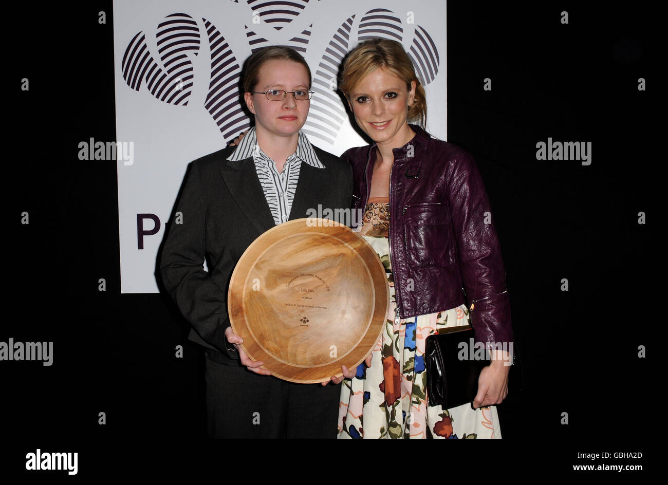 Young Achiever of the Year winner, Lisa Daly, poses with presenter ...