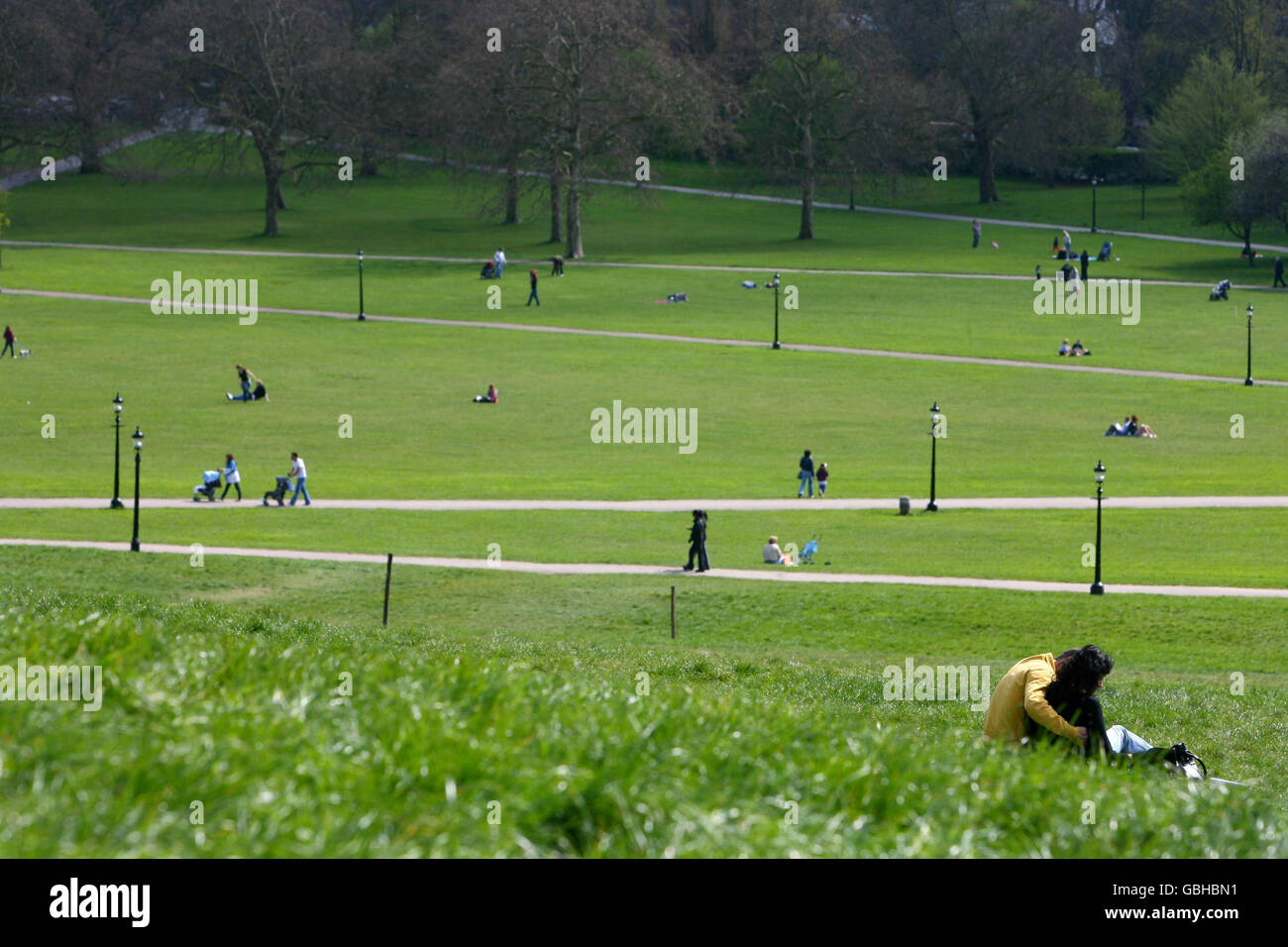 People enjoy the spring weather on Primrose Hill in north London Stock ...