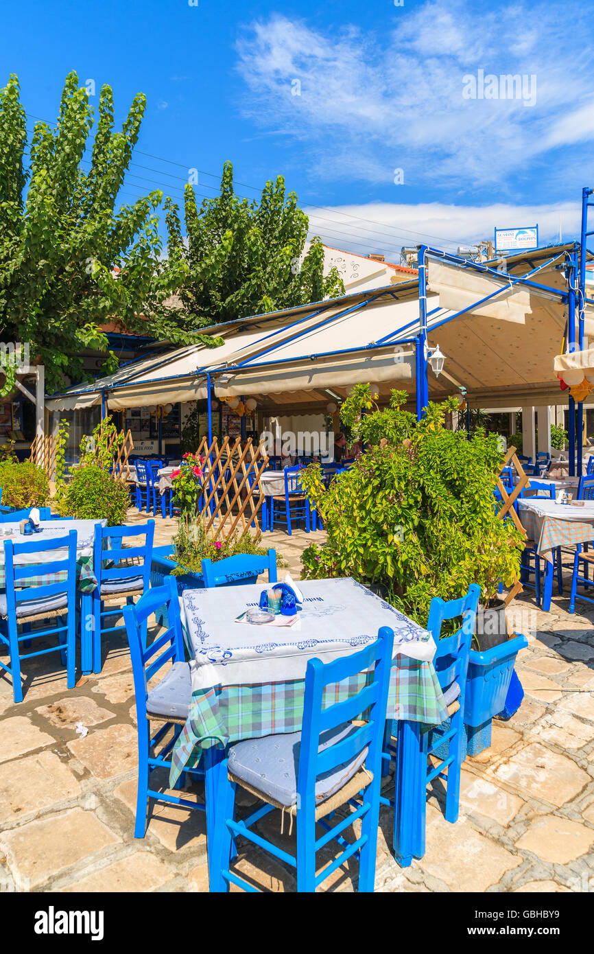 SAMOS ISLAND, GREECE - SEP 24, 2015: tables with blue chairs in ...