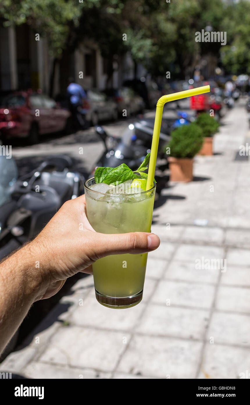 Hand and lemonade Stock Photo - Alamy