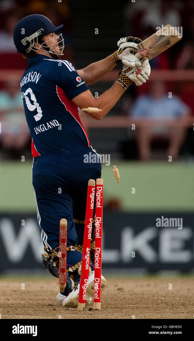 England's James Anderson is bowled by West Indies' Kieron Pollard ...