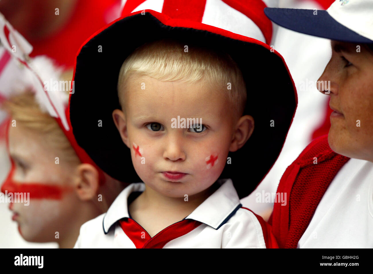 A young England fan enjoys the occasion with specially painted face ...