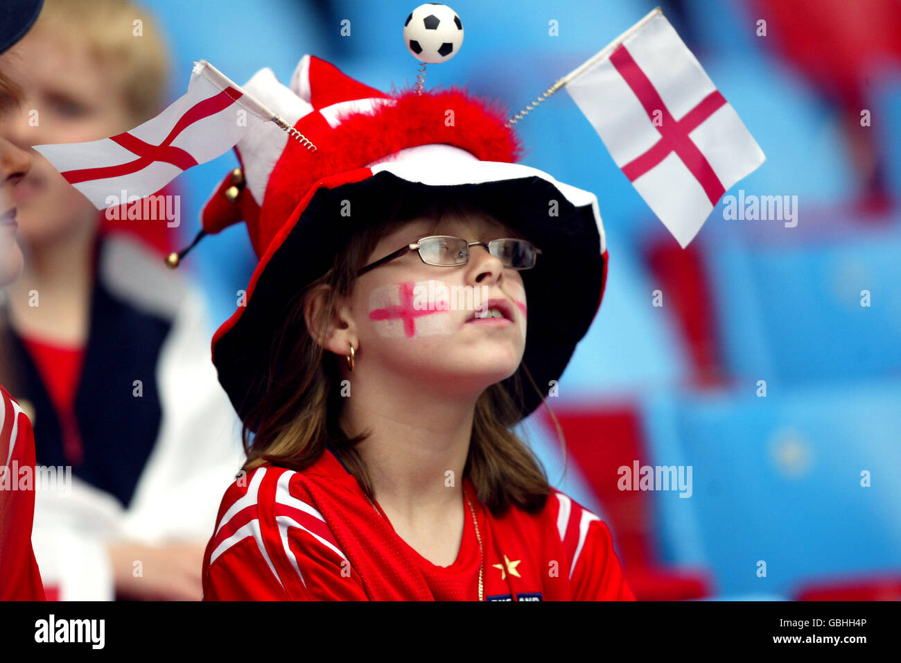 A young England fan enjoys the occasion with specially painted face ...